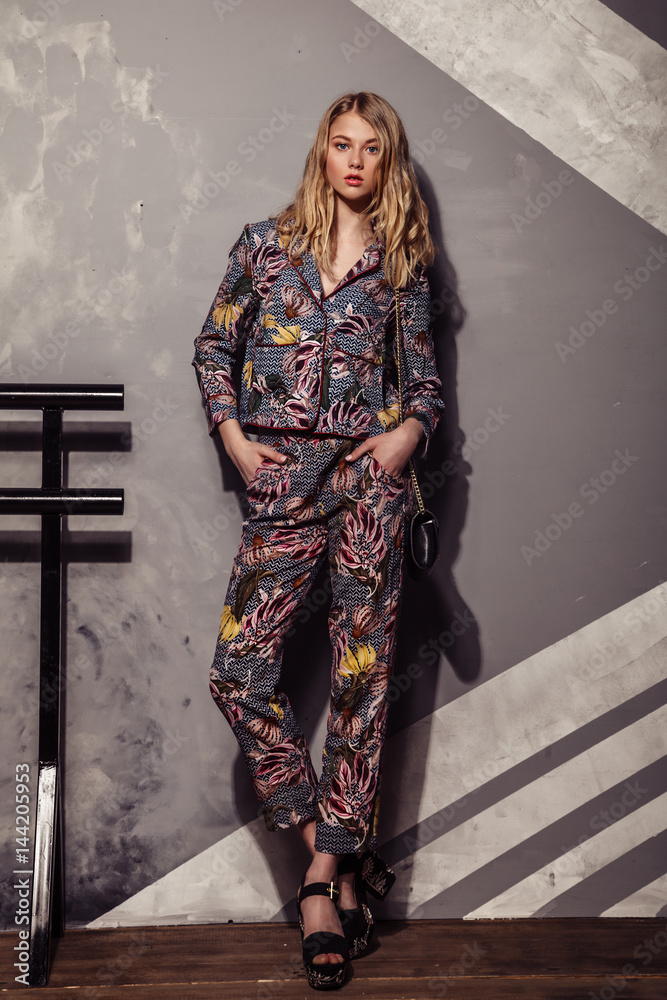 Fashion Model girl full length portrait in the patterned suit. High ...