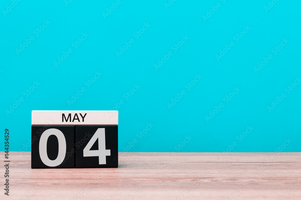 May 4th. Day 4 of month, calendar on turquoise background. Spring time ...