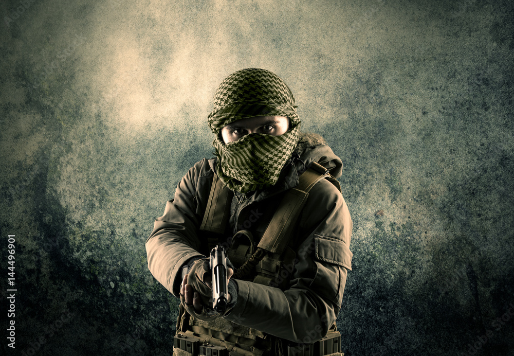 Portrait of a heavily armed masked soldier with grungy background Stock ...
