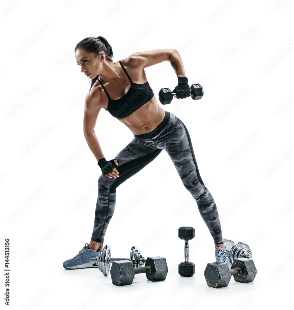 Athletic woman doing exercise for arms. Photo of muscular fitness model ...