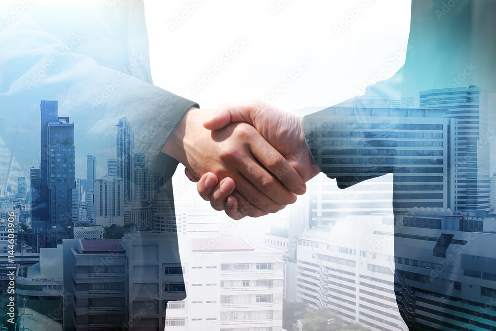 handshake of businessman on city background, double exposure. Stock ...
