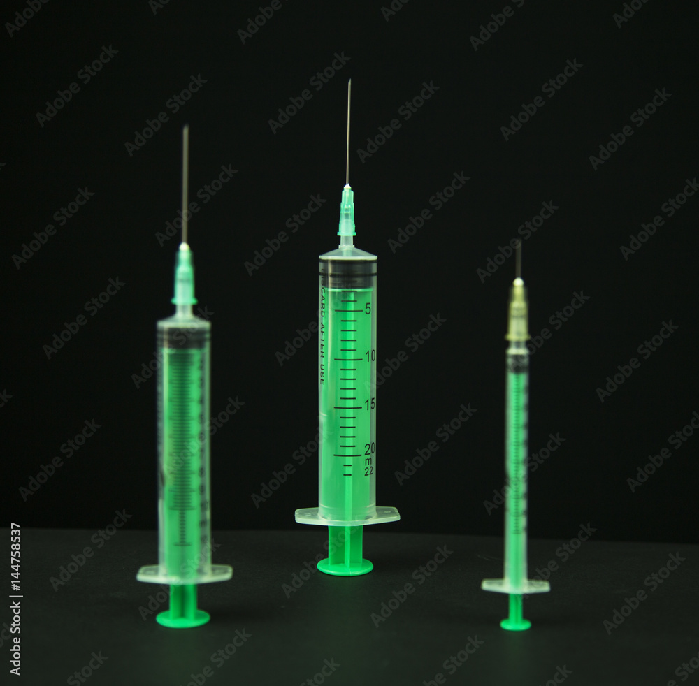 Medical needle isolated black background Stock Photo | Adobe Stock