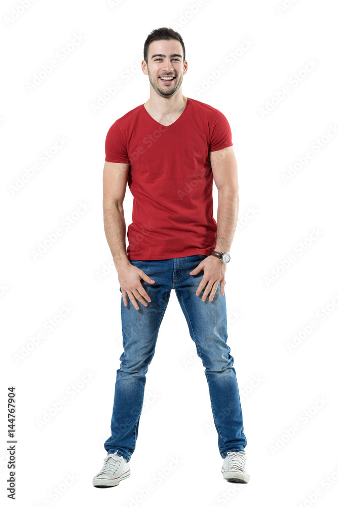 Relaxed young laughing casual man looking at camera. Full body length ...