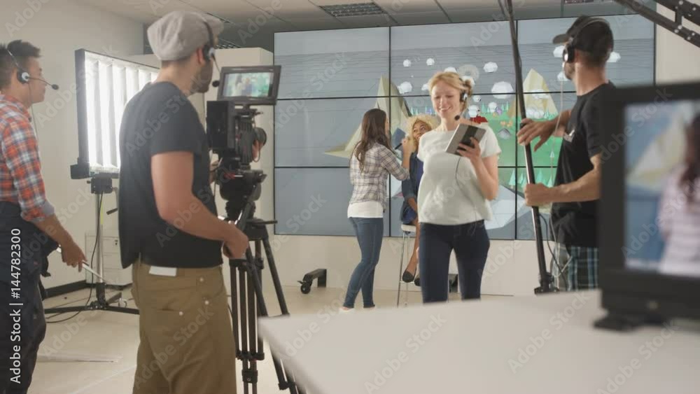 4K Crew member working behind the scenes on TV production set Stock ...