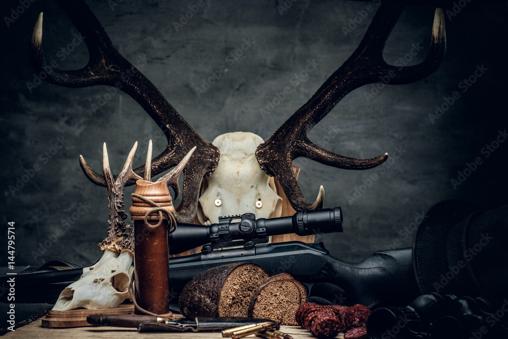 Retro hunting ammunition of rifle and binoculars. Stock Photo | Adobe Stock