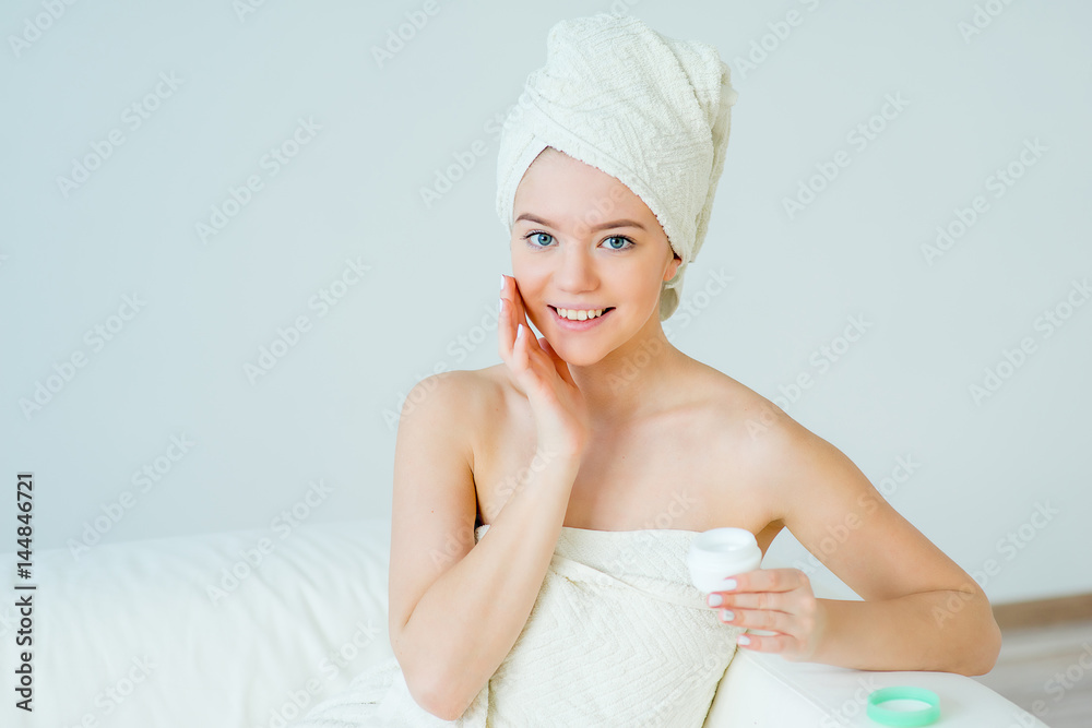Woman applying a cream Stock Photo | Adobe Stock