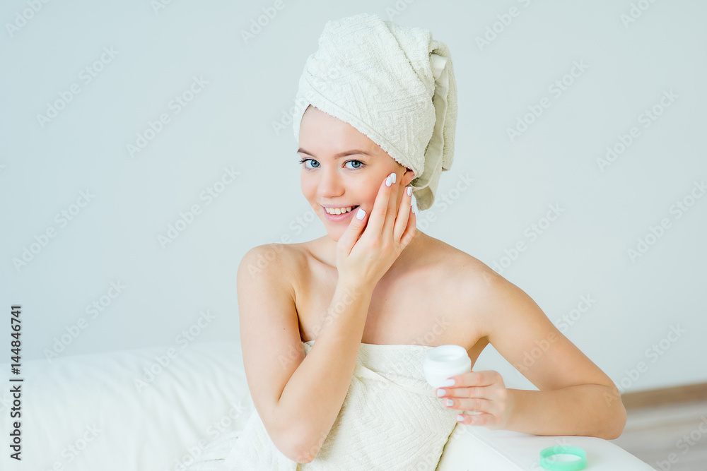 Woman applying a cream Stock Photo | Adobe Stock