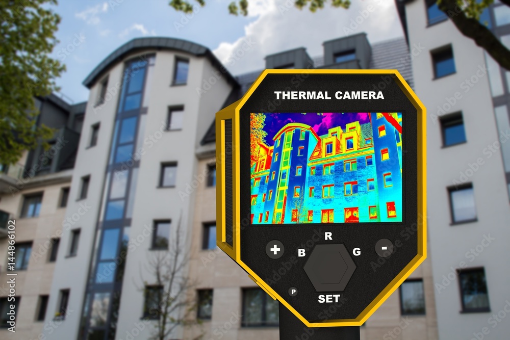 infrared thermal imager showing building facade and window heat loss ...