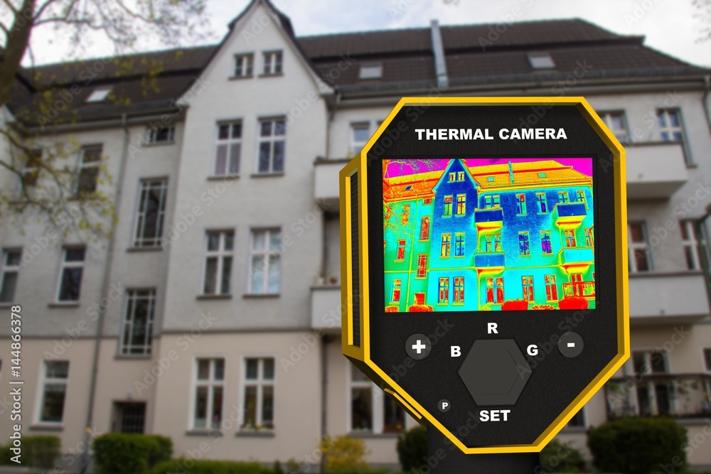 infrared thermal imager showing building facade and window heat loss ...
