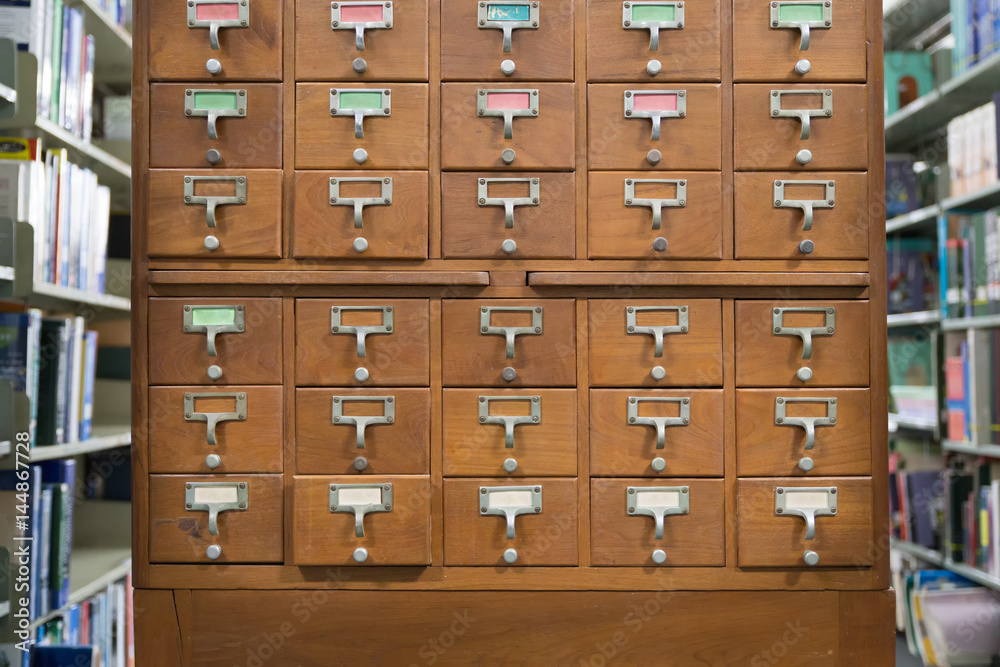 An old style wooden cabinet of library card or file catalog index ...