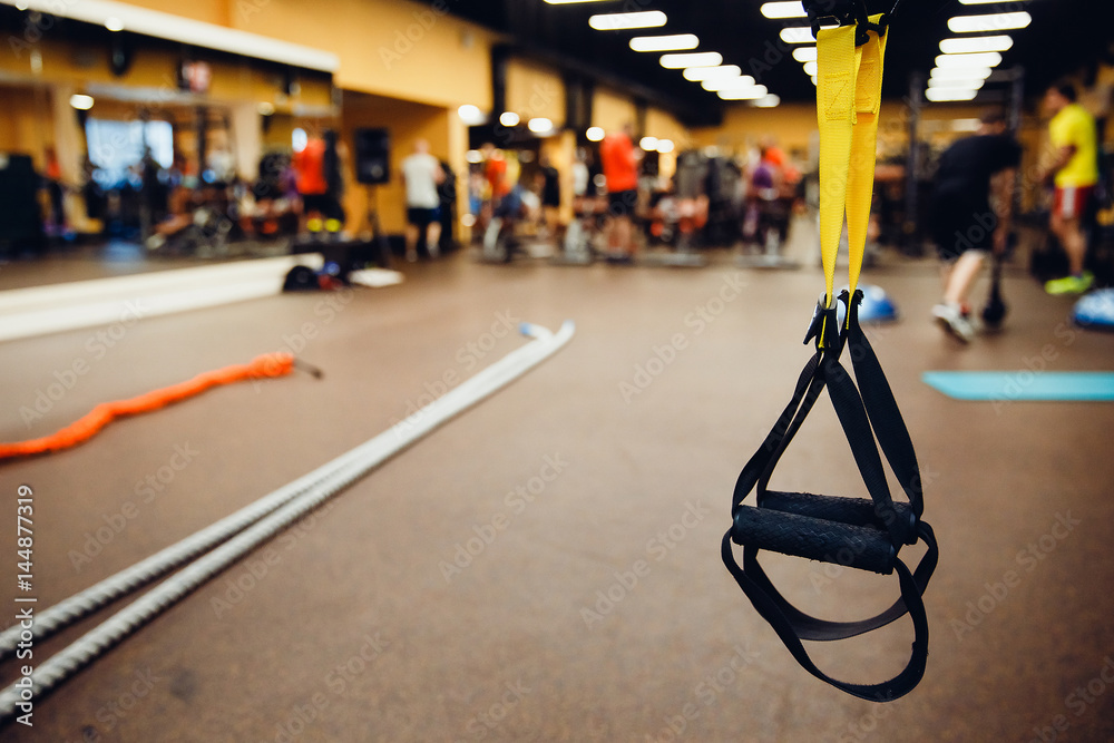 fitness straps of athletes in the gym. concept of stretching and ...