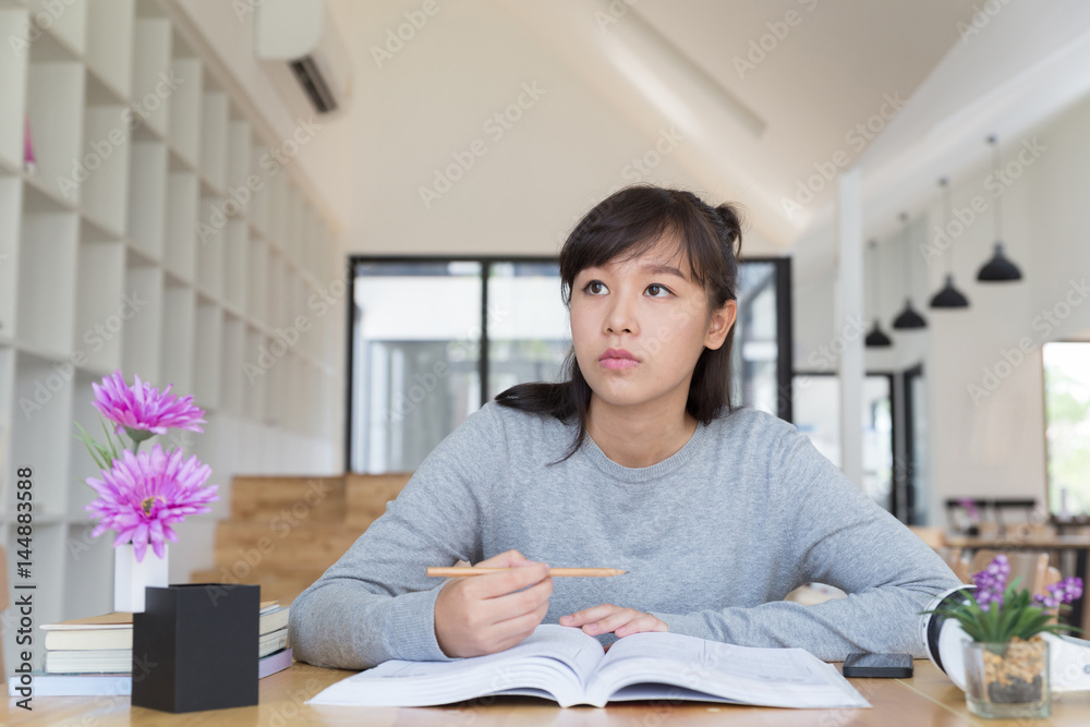 asian girl female teenager studying at school. Student reading book in ...