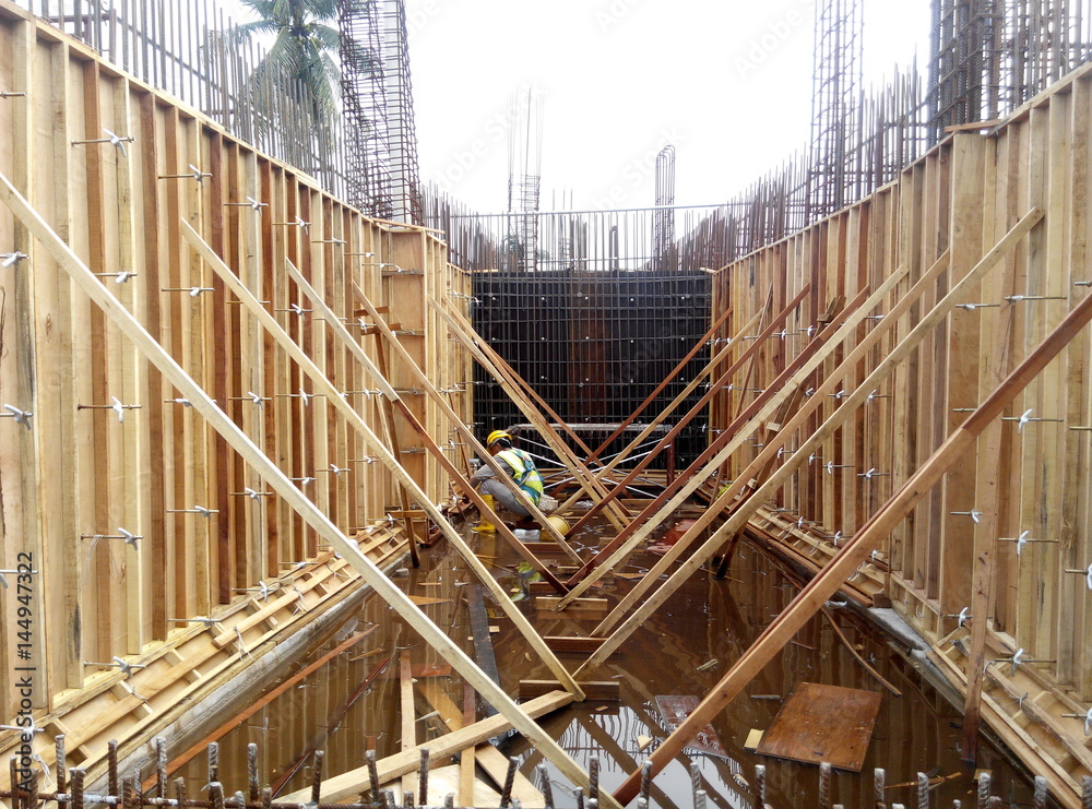 Timber form work and scaffolding used by construction workers at the ...