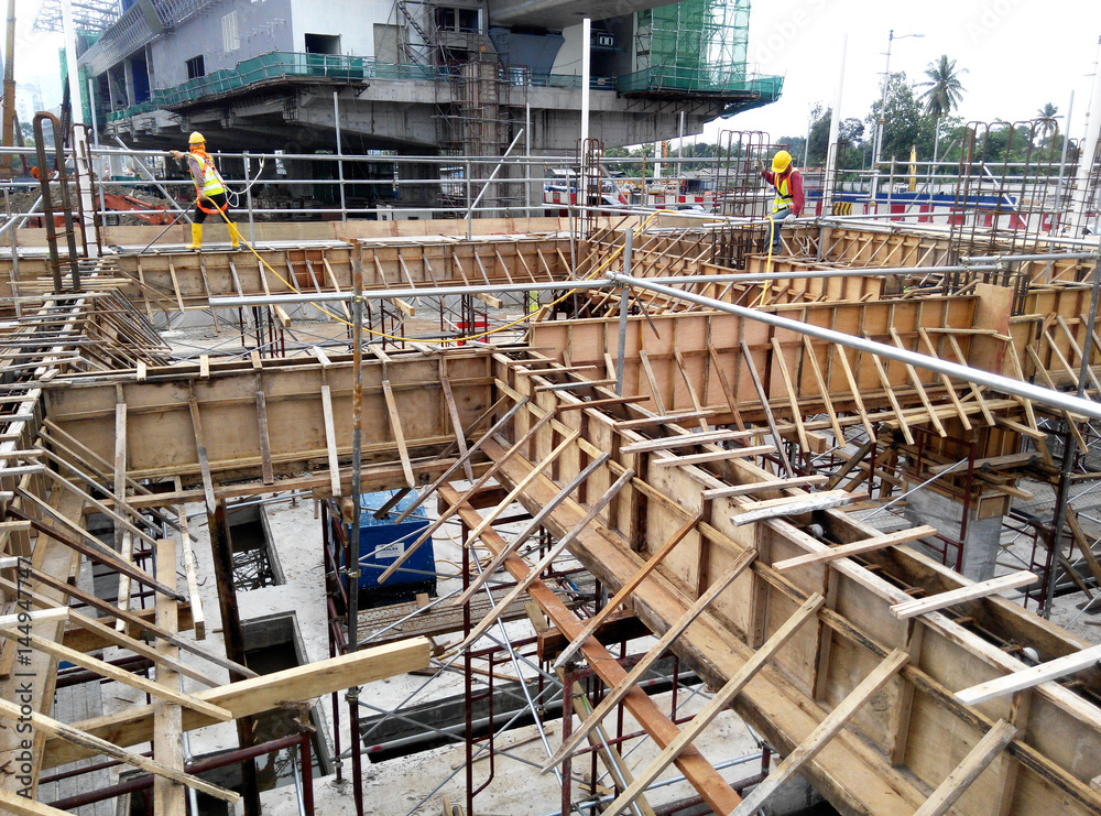 Timber form work and scaffolding used by construction workers at the ...