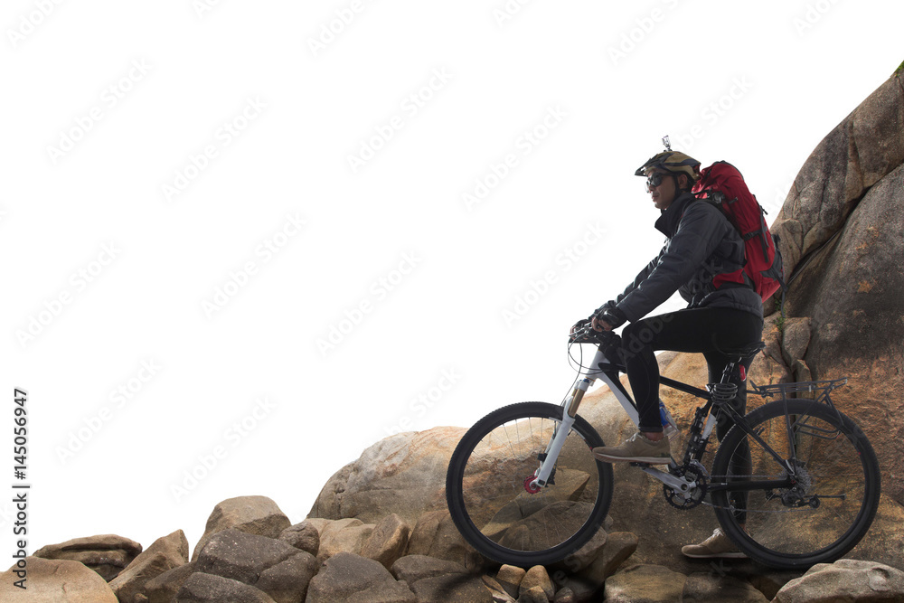 Confident mountain bike rider standing and observing the view, isolated ...