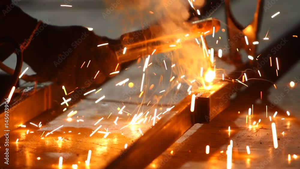 Electric welding for metal. / The male gloved hand holds the electrode ...