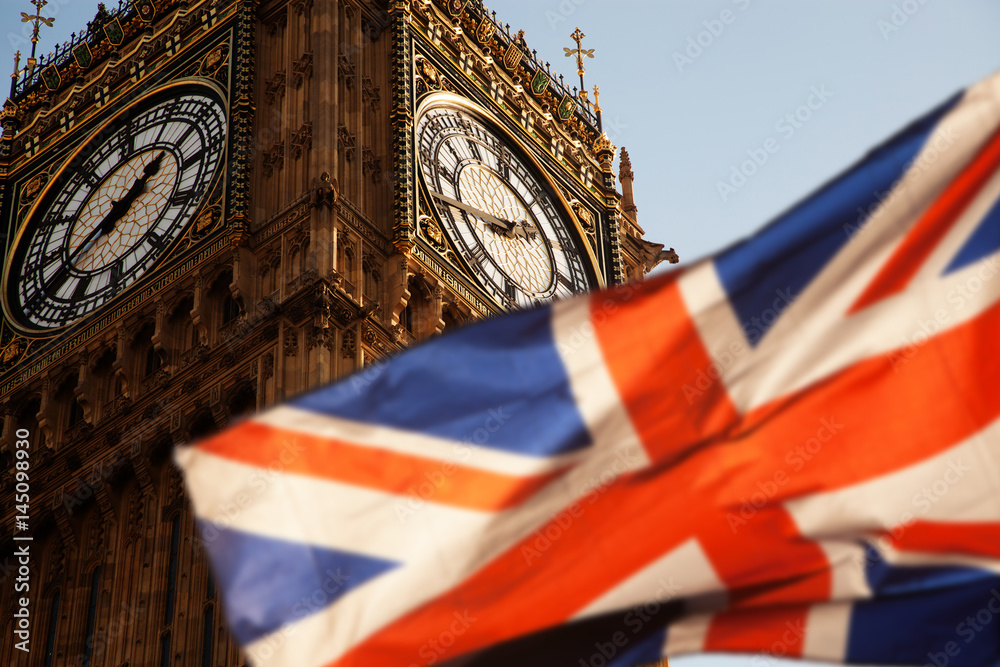union jack flag and iconic Big Ben at the palace of Westminster, London ...
