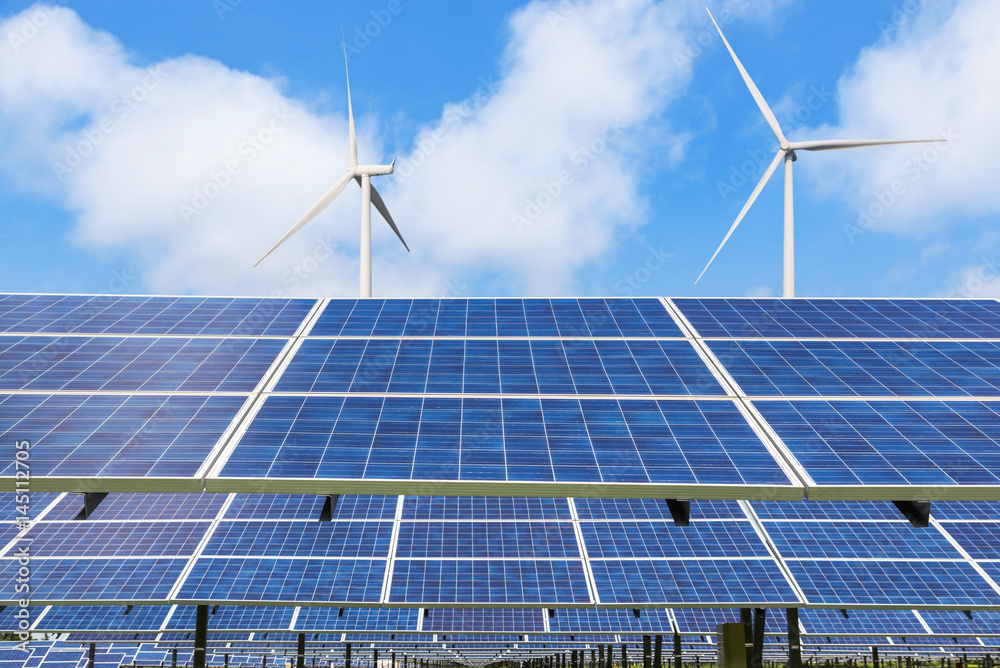 solar panels and wind turbines generating electricity in power station ...