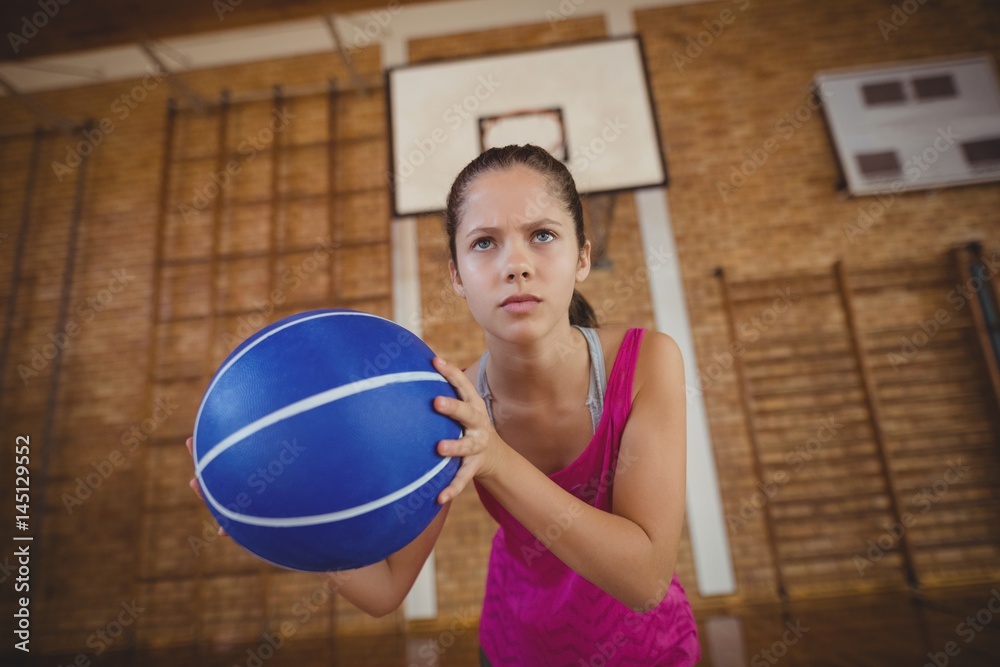 High school girl playing basketball in the court Stock Photo | Adobe Stock