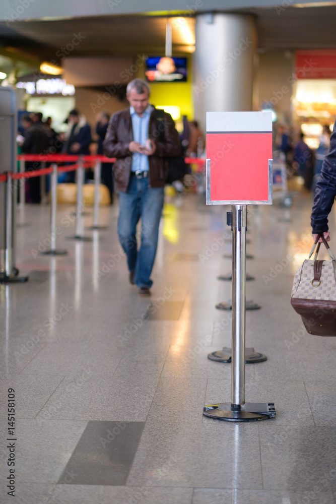 Waiting lines and information labels in front of check-in desks in ...