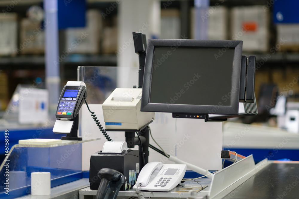 Cash desk with screen and card payment terminal in huge department ...