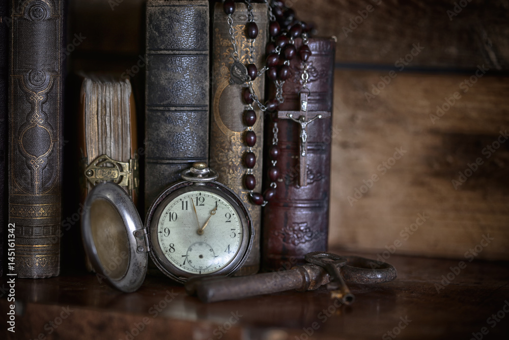 ancient bibles with pocket watch. Stock Photo | Adobe Stock