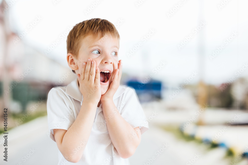 Little boy show emotions at park background with light Stock Photo ...