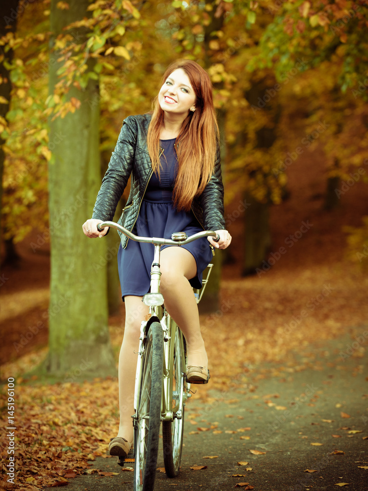 Girl in dress on bike. foto de Stock | Adobe Stock