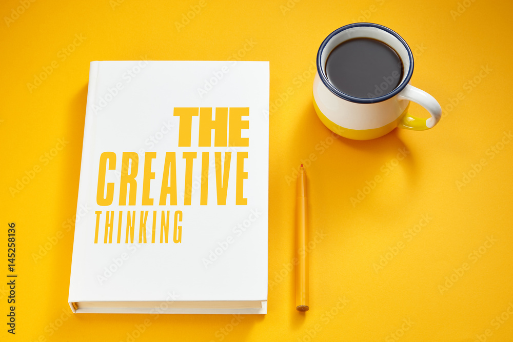 white book on the yellow background Stock Photo | Adobe Stock
