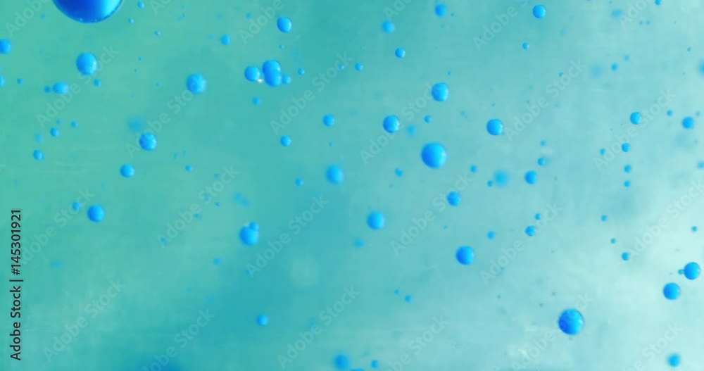Stars wars of the planet.Color drops floating in oil and water over a ...