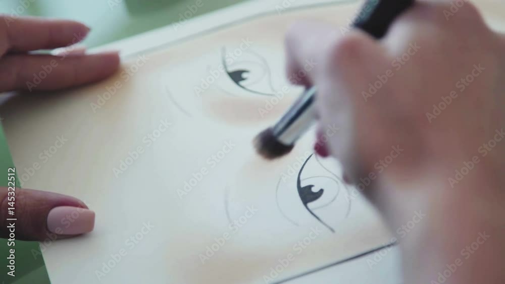 Inspiration: the make-up artist draws face-lines on watercolor paper ...