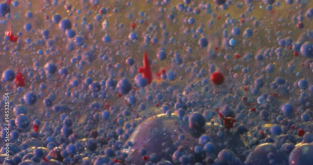 Stars wars of the planet.Color drops floating in oil and water over a ...