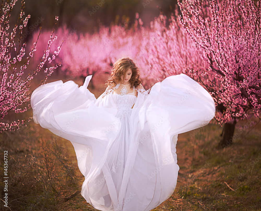 Beautiful girl in peach garden Stock Photo | Adobe Stock