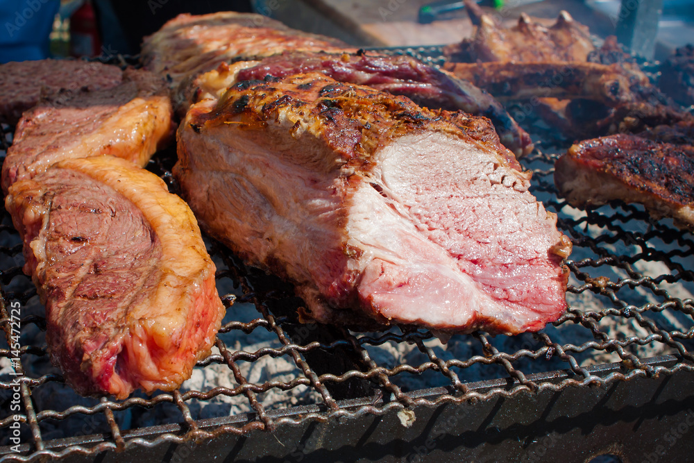 Meat that is grilled. Burgers, roast beef and large pieces of pork ...