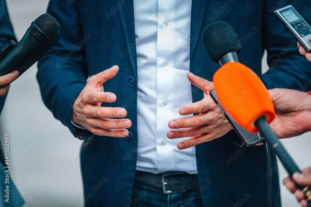Interviewing businessman on press conference Stock Photo | Adobe Stock