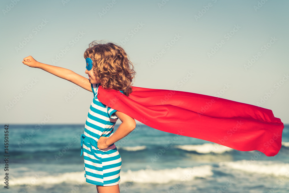 Superhero child on the beach. Summer vacation concept Stock Photo ...