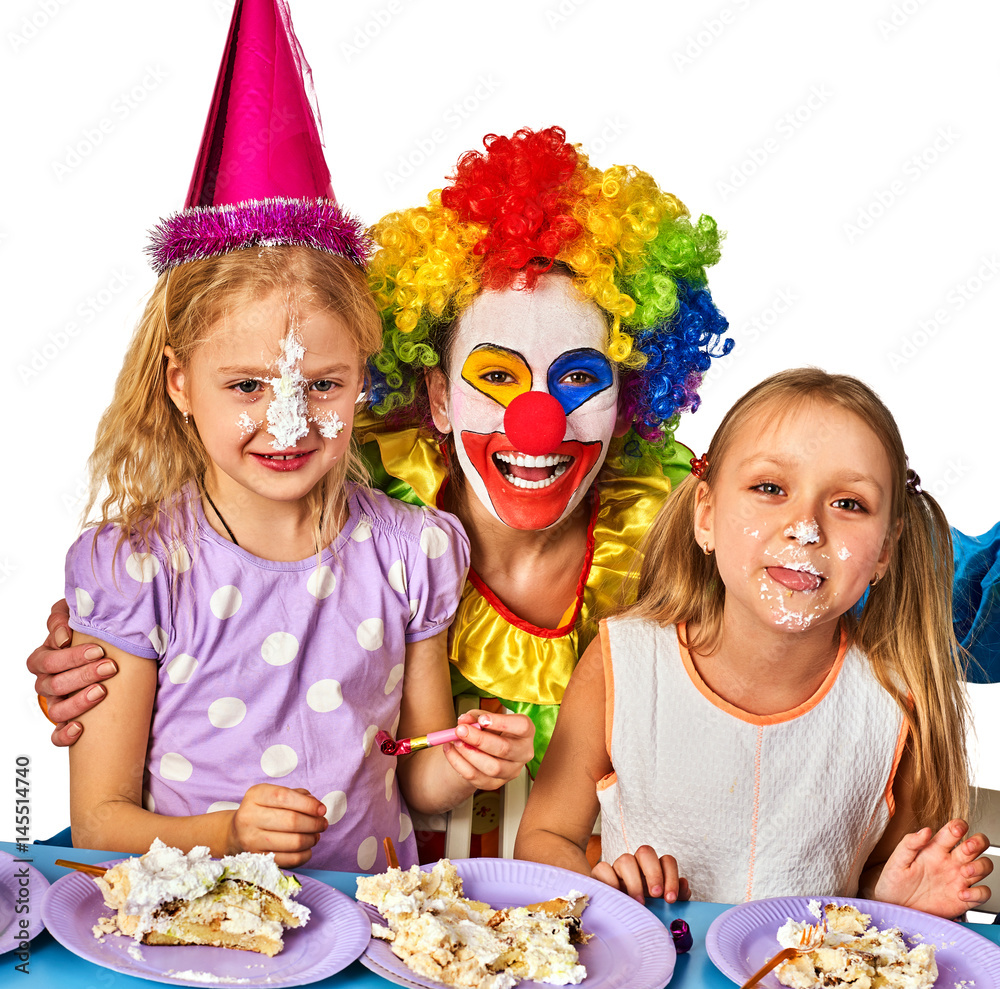 Birthday children clown eating cake with two girl together. Kids with ...