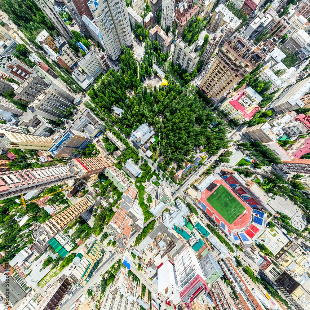 Aerial city view with crossroads and roads, houses, buildings, parks ...