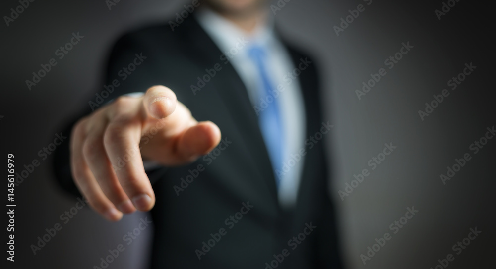 Businessman pointing his finger Stock Photo | Adobe Stock