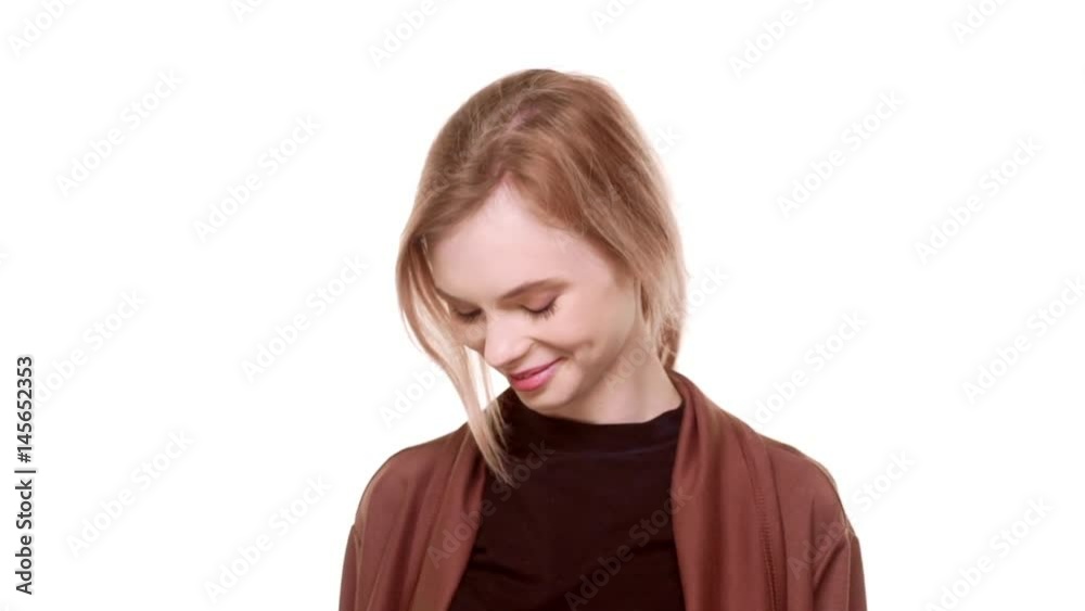 Beautiful shy Caucasian teenager girl looking with embarrassment at ...