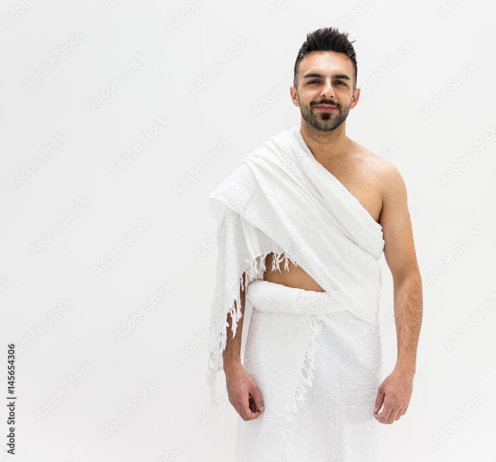 Muslim man posing as ready for Hajj visiting Kaaba in Mecca Stock Photo ...