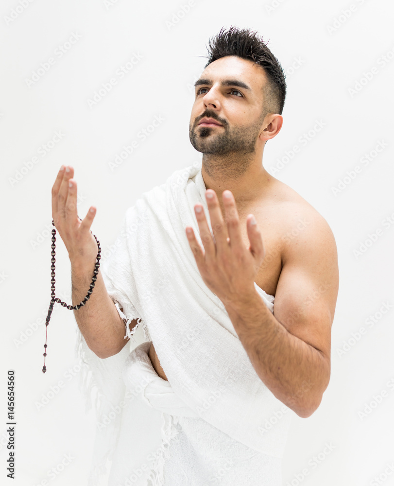 Muslim man posing as ready for Hajj visiting Kaaba in Mecca Stock Photo ...