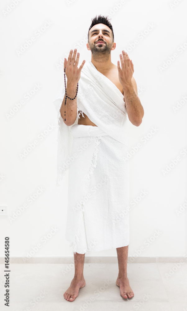 Muslim man posing as ready for Hajj visiting Kaaba in Mecca Stock Photo ...