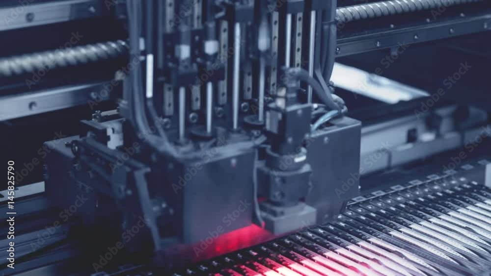 Automated Electronic circuit board production close up. Machine Printe ...