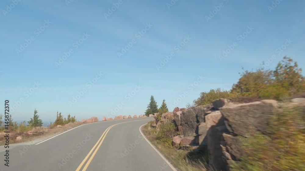 FPV, CLOSE UP: Traveling up the cliffy mountain slope on winding ...