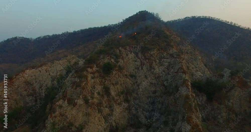 wildfire on top of the mountain on the second day. The fire is wide ...