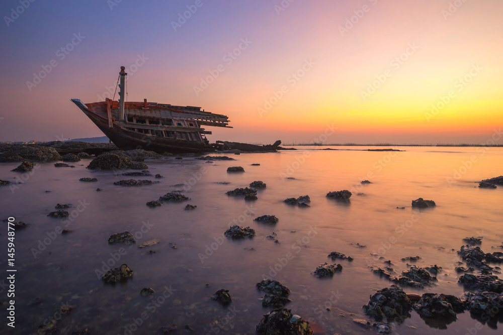 Fishing boat aground on the rocks for a long time at sea erosion ...