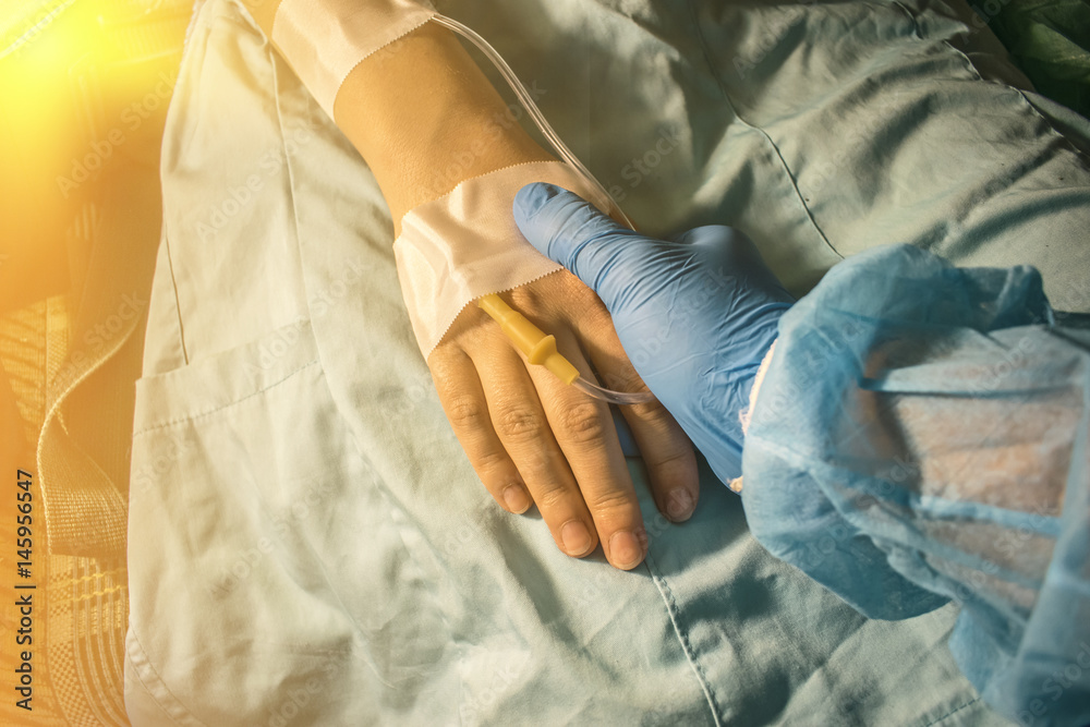 Doctor's gloved hand comforting cancer patient, cancer gene DNA ...