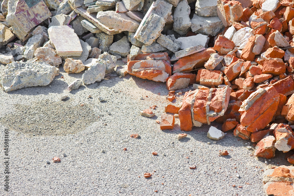 Concrete and brick rubble debris on construction site after a ...