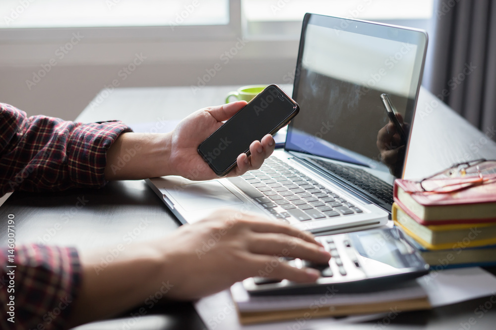 documents on office table with laptop computer and graph of business ...